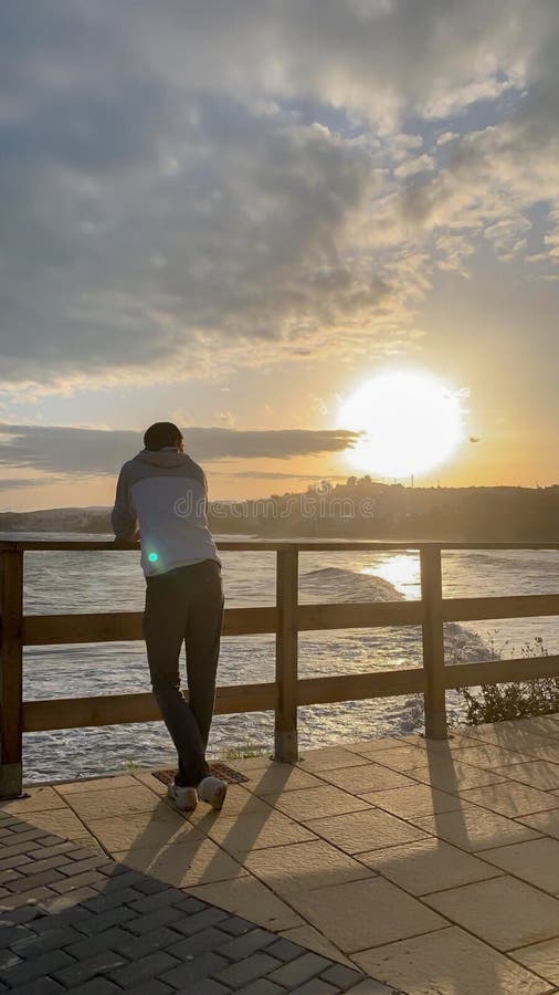 Boy with sunset stock photo. Image of ocean, clouds - 147820746
