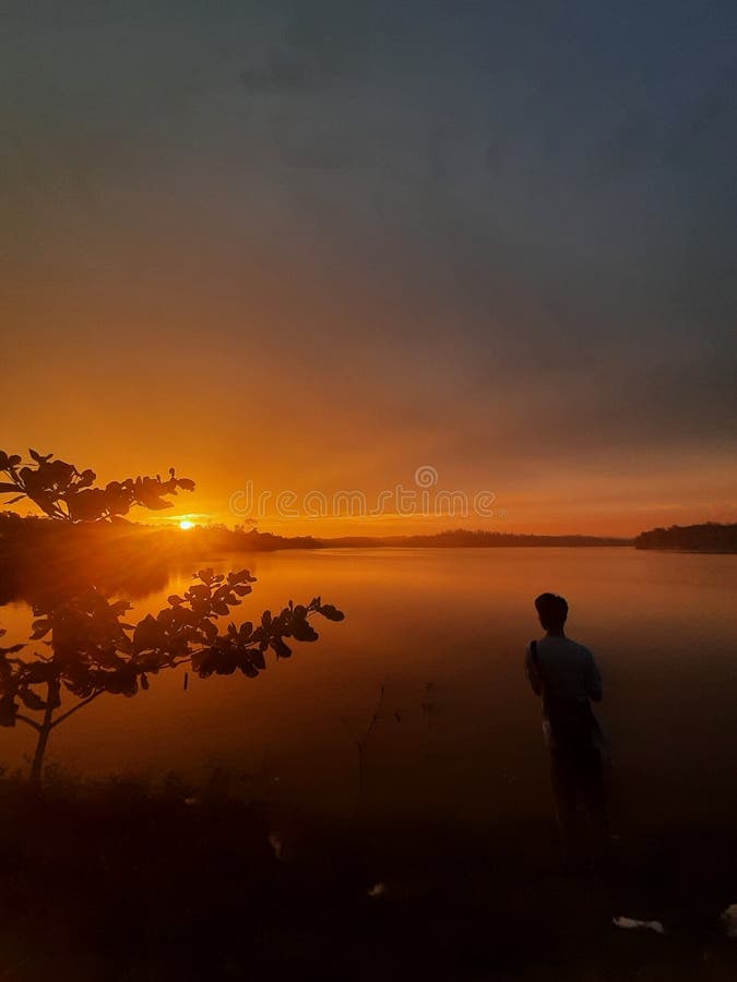 Sunset Shadows Cast from Beach Huts Towards Shore and Beautiful Sky ...