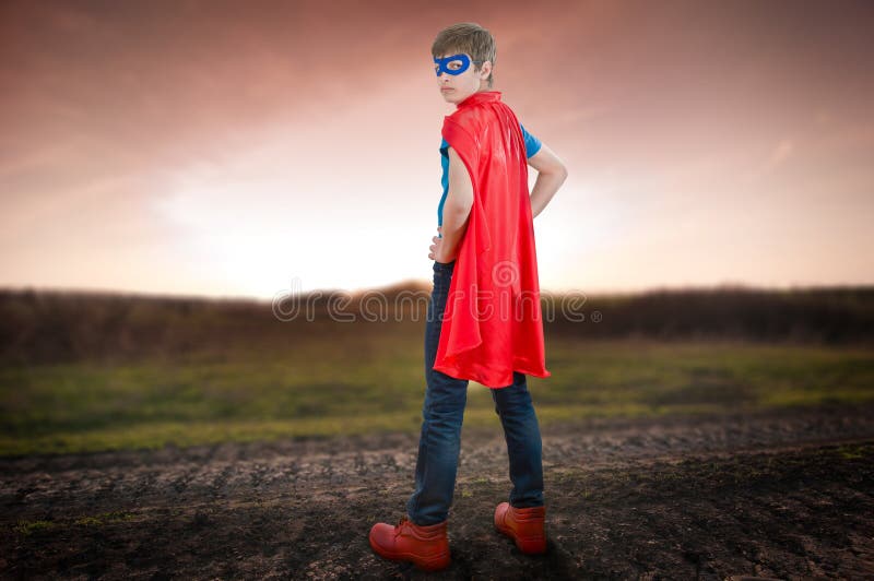 Super Hero Boy in Red Boxing Gloves and a Cape in the Wind. Stock Photo ...