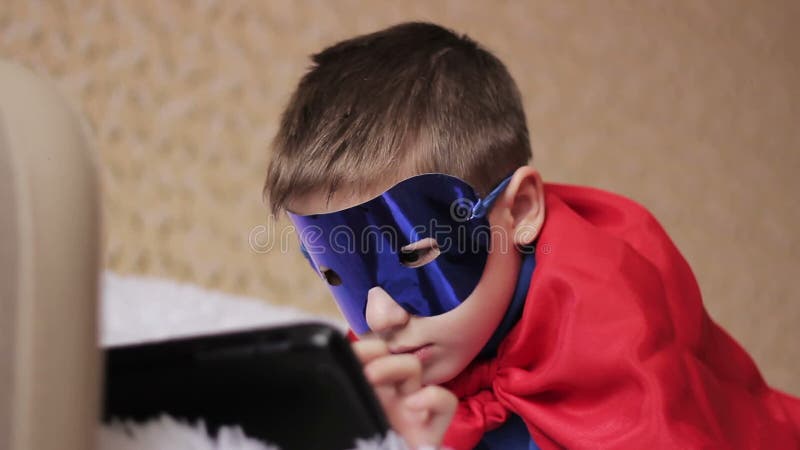 Boy superhero with tablet stock video. Video of digital - 67573177