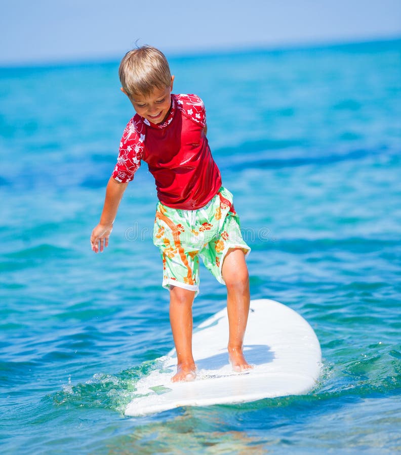 Boy with surf stock photo. Image of surfer, happy, pacific - 49604412