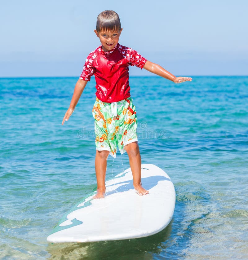 Boy with surf stock image. Image of leisure, splash, happy - 53283683
