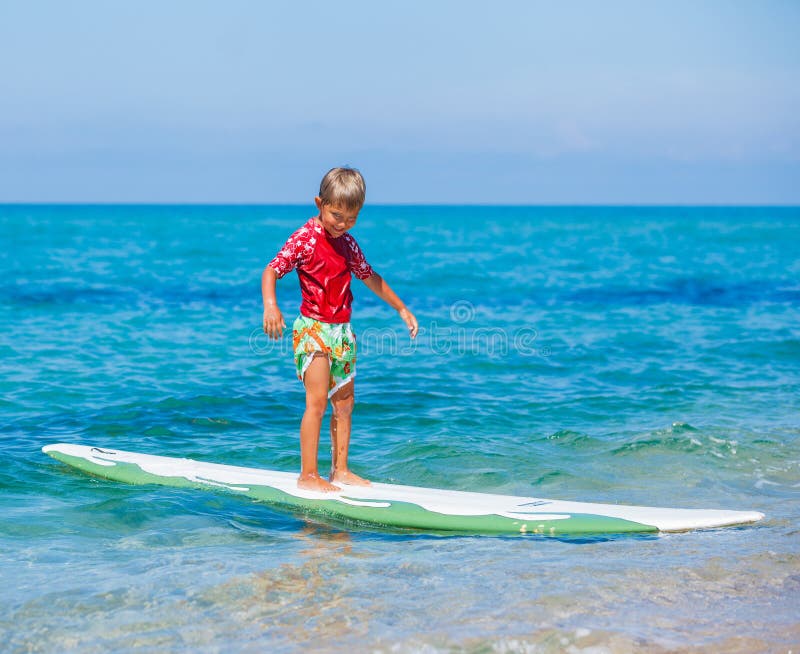 Boy with surf stock photo. Image of surfboard, surfer - 53283956