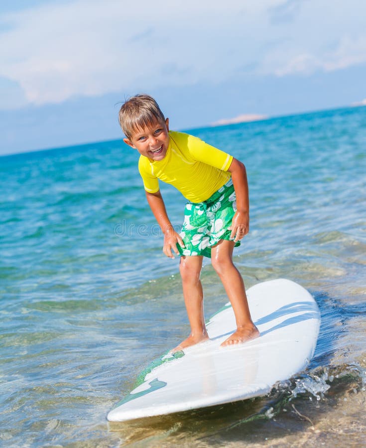 Boy with surf stock image. Image of handsome, board, summer - 54089023
