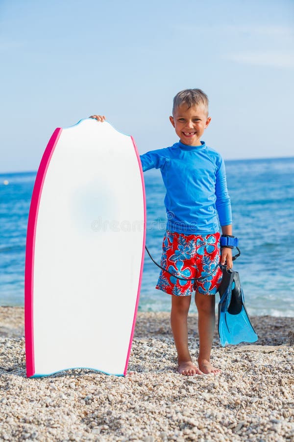 Boy with surf stock image. Image of active, blue, face - 68504805