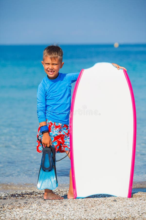 Boy with surf stock photo. Image of board, enjoyment - 68452270