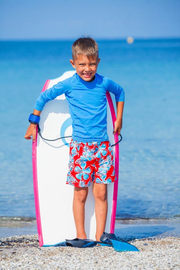 Boy with surf stock image. Image of recreation, leisure - 68452351