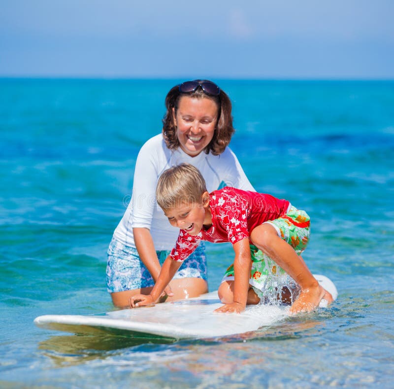 Boy with surf stock photo. Image of active, surfer, seashore - 53987502