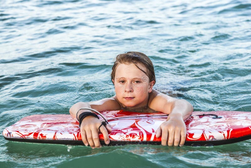 Boy with surfboard stock photo. Image of fresh, adolescent - 50157142