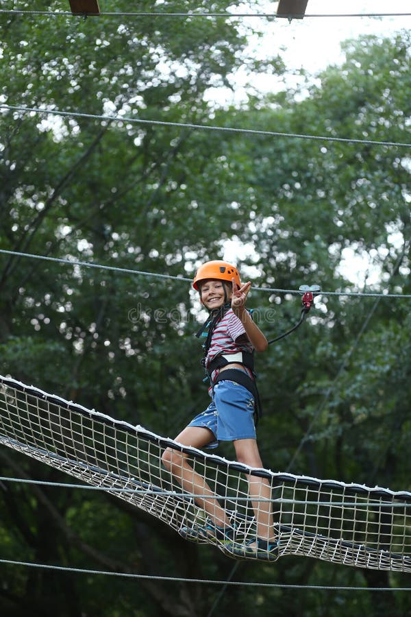 Boy Surmounting Obstacle Course in the Outdoor Rope Park Stock Image ...