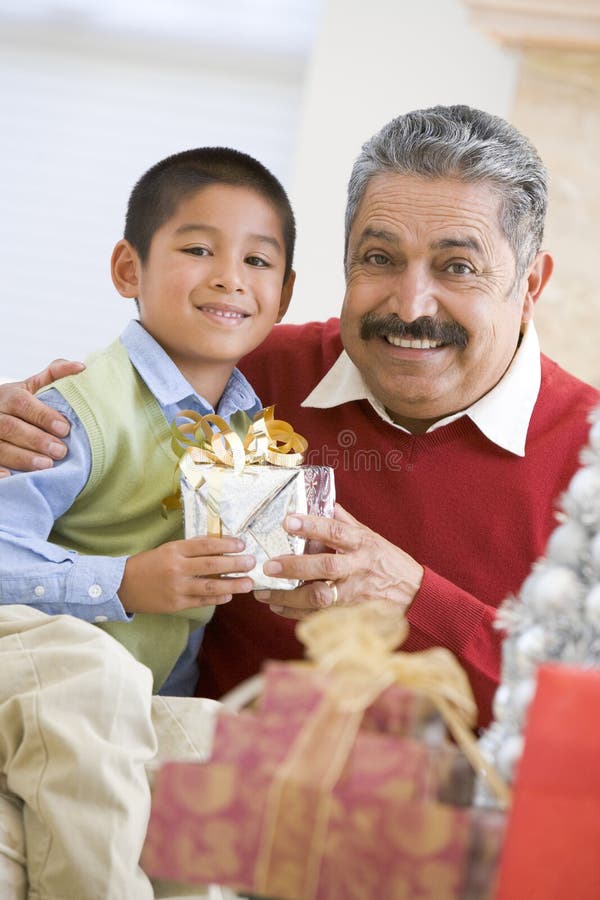 Boy Surprising Father with Christmas Present Stock Image - Image of ...