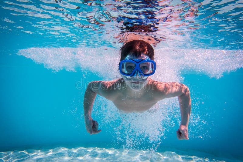 Boy swim in swimming pool stock image. Image of caucasian - 89026671
