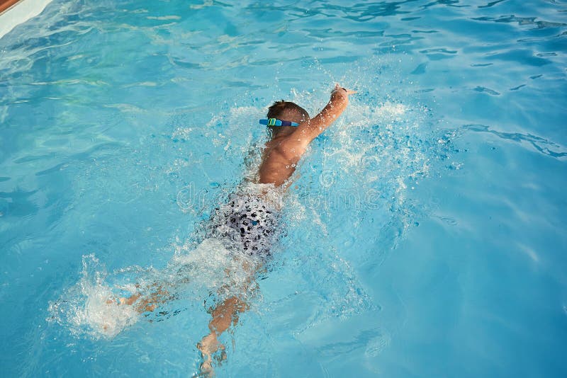 5 Years Old Boy in Swimming Pool on Inflatable Colorful Ring Stock ...