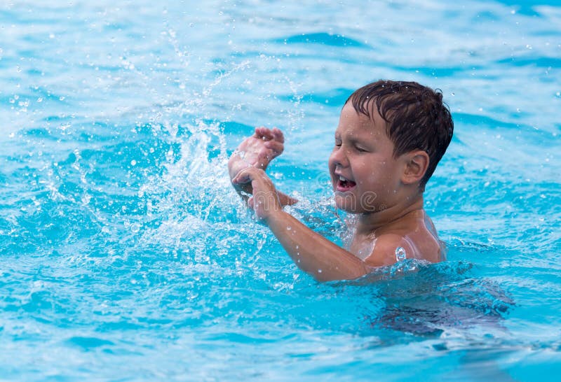 The Boy is Swimming in the Pool Stock Photo - Image of cheerful ...