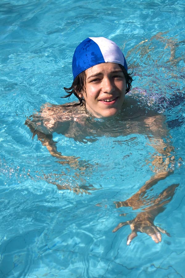 Boy in the swimming pool stock image. Image of teen, water - 10760583