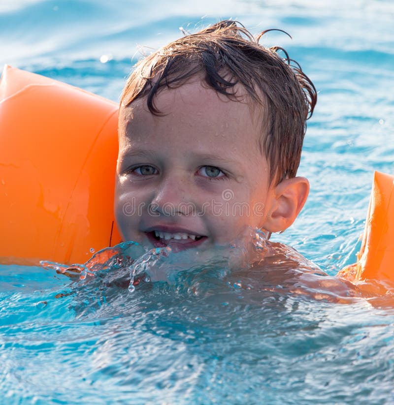 The Boy Is Swimming In The Pool Stock Image - Image of outdoor, splash ...