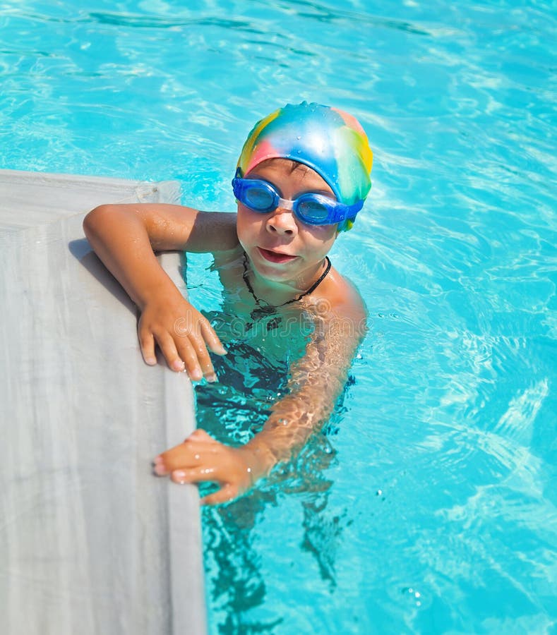 Boy in a swimming pool stock photo. Image of activity - 25237178