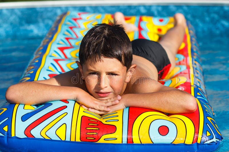 Boy in swimming pool stock image. Image of recreation - 25626767