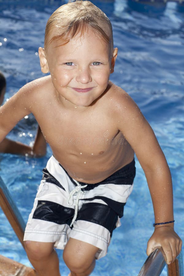Boy is in the Swimming Pool Stock Photo - Image of sunlight, game: 25895554