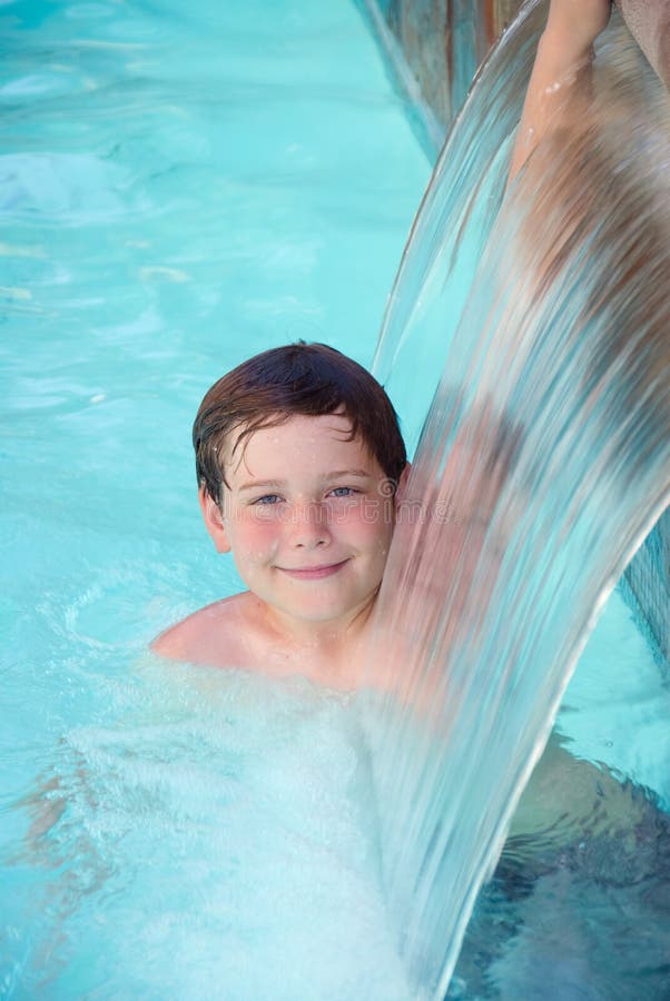 Boy and swimming pool stock photo. Image of playing, outside - 26744300