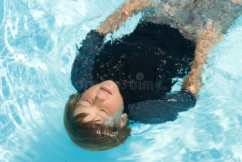 Boy Swimming in Pool with Float Ring Stock Image - Image of float ...