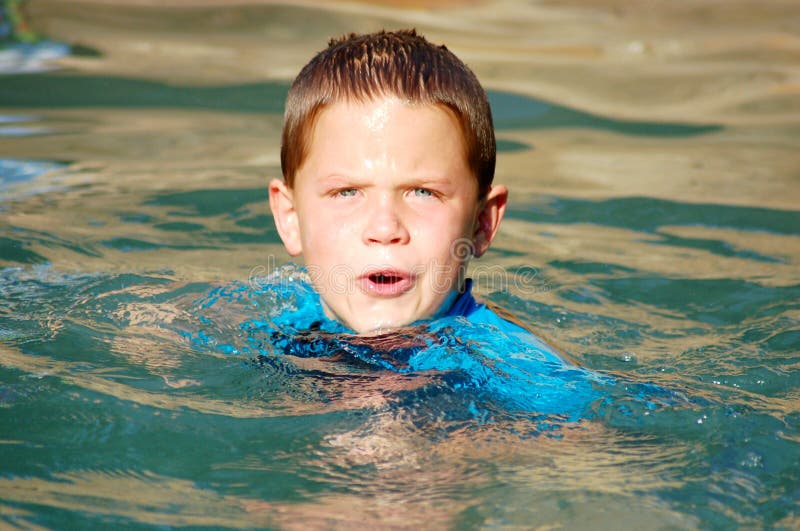 Boy swimming in the pool stock image. Image of blue, swimming - 7869681