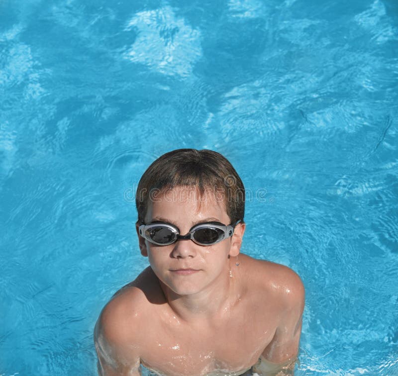 Boy jumping into the pool stock photo. Image of swimming - 7076692