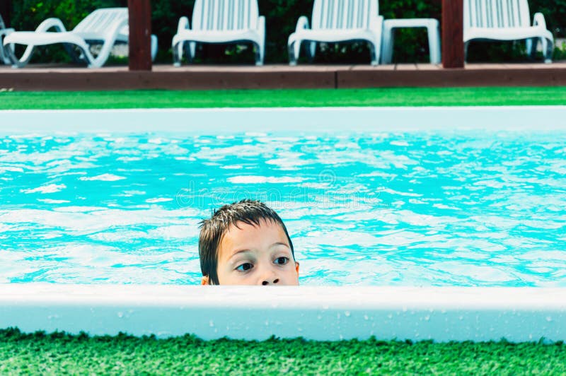 Boy in swimming pool stock photo. Image of learning, peace - 51647240