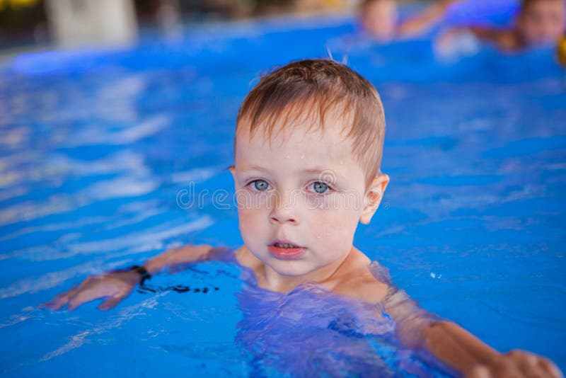 Boy in swimming pool stock image. Image of spray, pool - 88345227