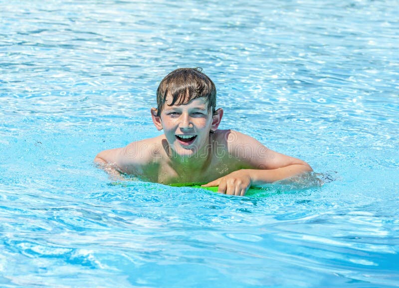 Boy swimming in the pool stock photo. Image of laugh - 38388208