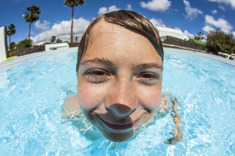Boy swimming in the pool stock photo. Image of blue, handsome - 35041256