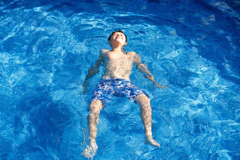 Boy in the swimming pool stock photo. Image of cheerful - 42609972