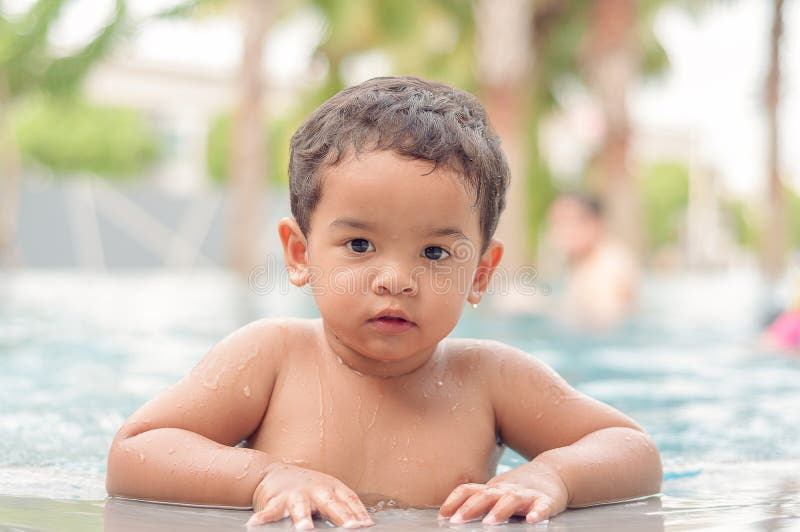 Boy in the swimming pool stock photo. Image of leisure - 44144042
