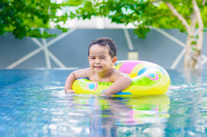 Boy in the swimming pool stock photo. Image of leisure - 44144042