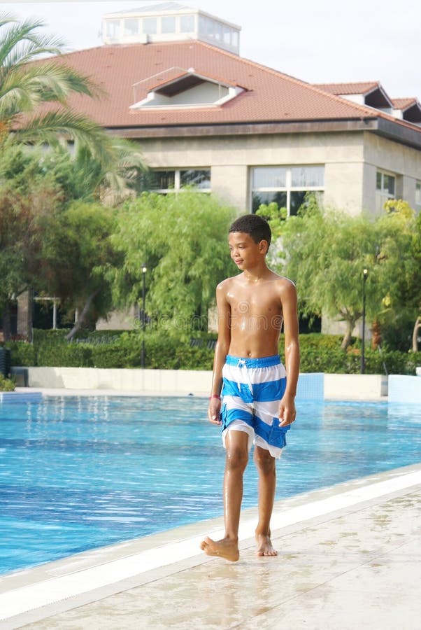 Boy at swimming pool. stock image. Image of beautiful - 77491019