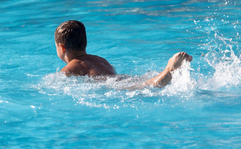 Boy Swims with a Splash in the Water Park Stock Image - Image of summer ...