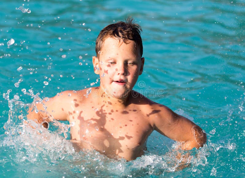 Boy Swims with a Splash in the Water Park Stock Photo - Image of child ...