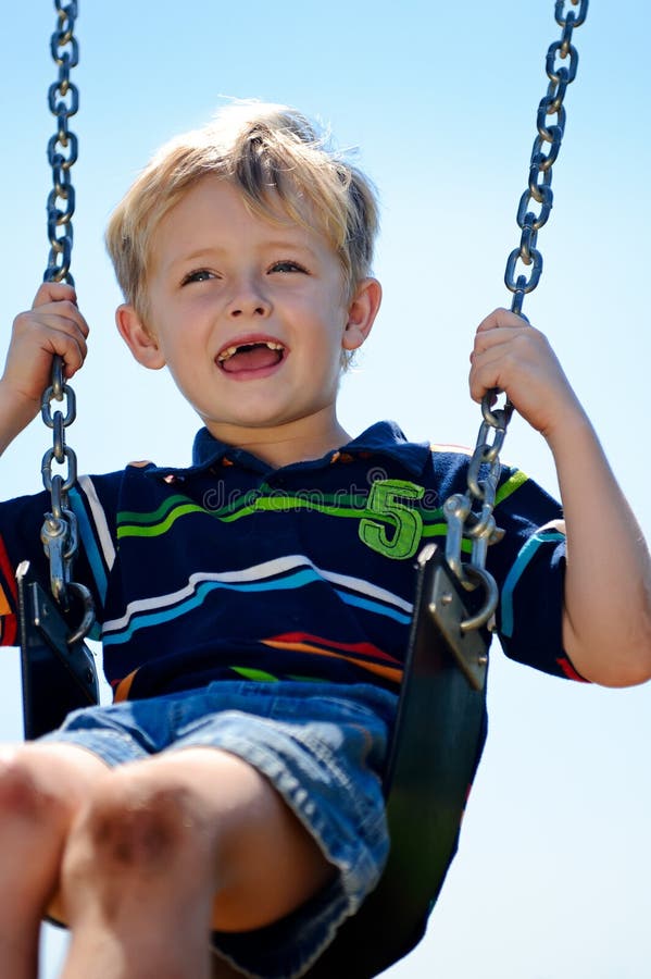 Boy on swing stock image. Image of male, summer, little - 17218083