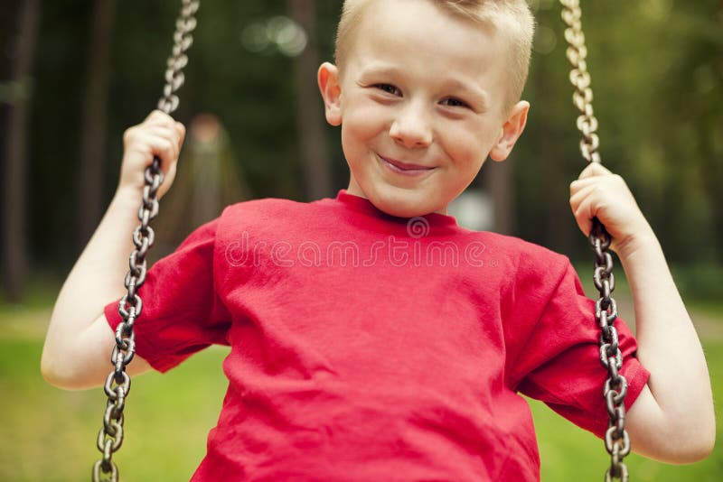 Boy on swing stock image. Image of face, motion, leisure - 29337649
