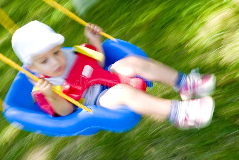 Boy in swing stock image. Image of small, cute, swinging - 4065279