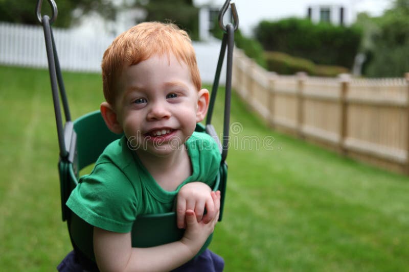 Boy on swing stock photo. Image of cute, outside, eyes - 9921096