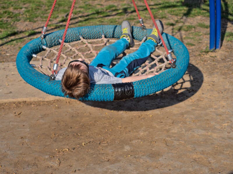 Boy on swing stock photo. Image of chil, outdoor, toddler - 245571644