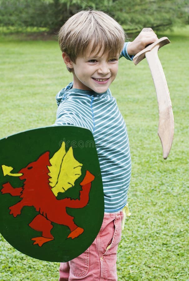 Boy sword shield grass stock photo. Image of cute, shield - 36343668