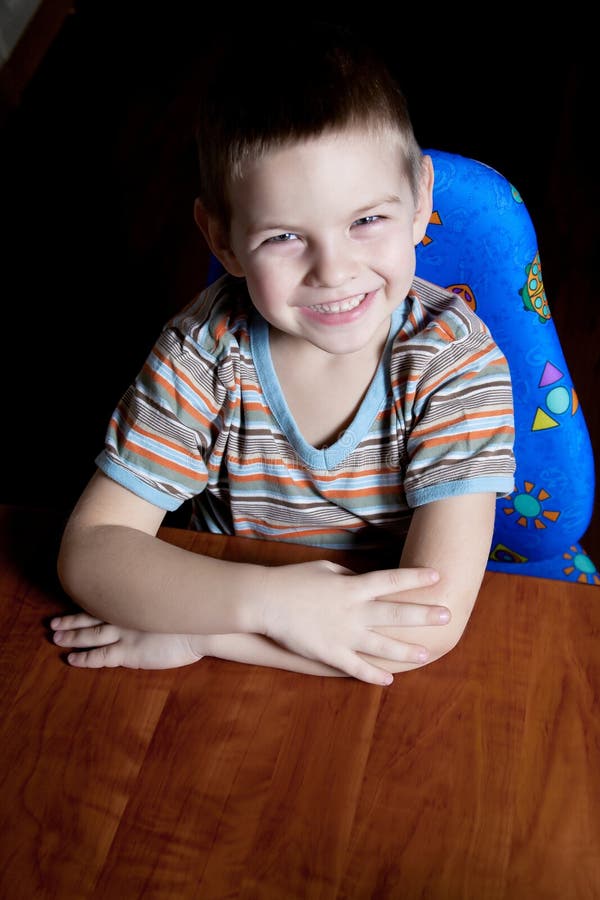 Boy at the table stock photo. Image of pepper, shirt - 12592134