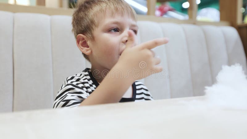 Boy at Table Eating Cotton Candy Stock Video - Video of happiness ...