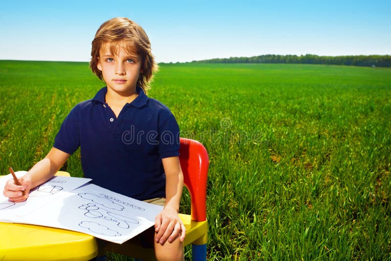 Boy at table in field stock photo. Image of blue, cute - 14369630