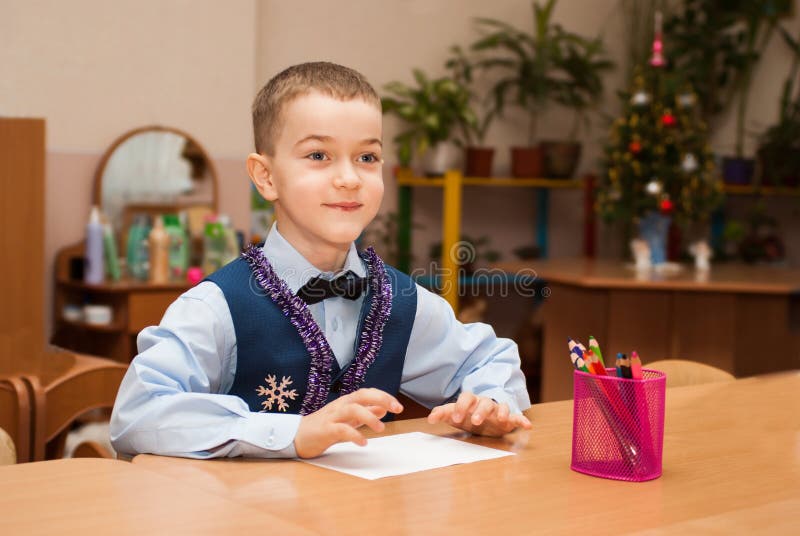 Boy at the table stock image. Image of christmas, close - 64956403