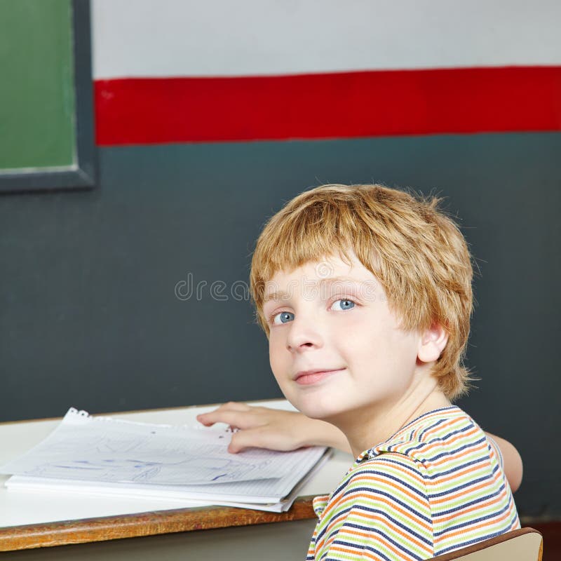 Boy at table in school stock image. Image of learn, child - 46734483
