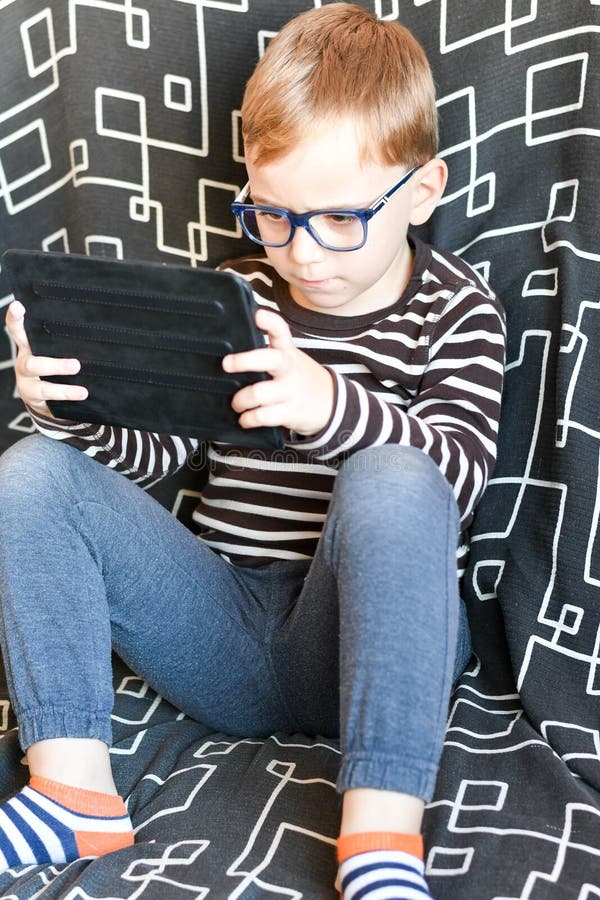 Boy with tablet stock photo. Image of eyepatch, focus - 102584532