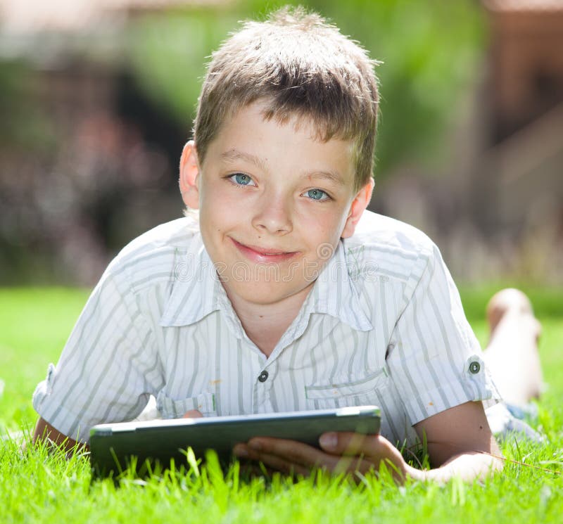 Boy with tablet stock image. Image of beautiful, meadow - 41142965